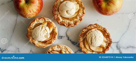 Top View Of Mini Apple Pies With Ice Cream On White Marble Counter