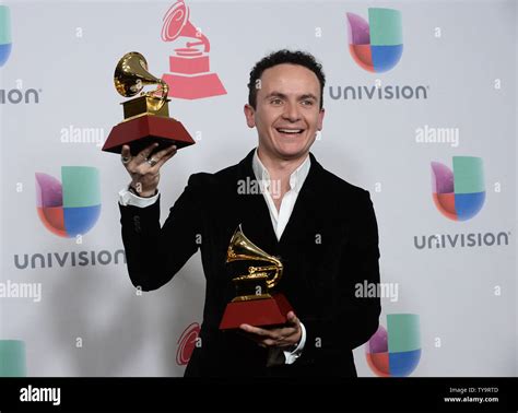 Fonseca Appears Backstage With The Awards For Best Tropical Song For