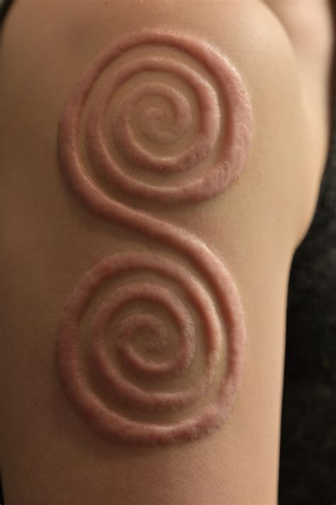 Healed Scarification Tattoos