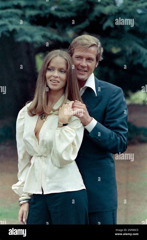 Actor Roger Moore Right Poses With American Actress Barbara Bach His