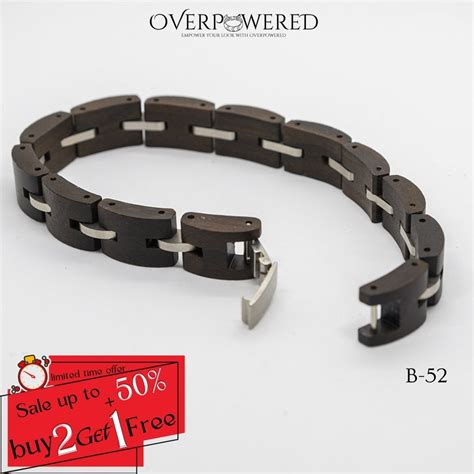 Overpowered B 52 أسورة خشب أبنوس × ستانلس ستيل فضي 📌 تصميم كلاسيكي راقي، مقاوم للتشقق والصدأ 📌
