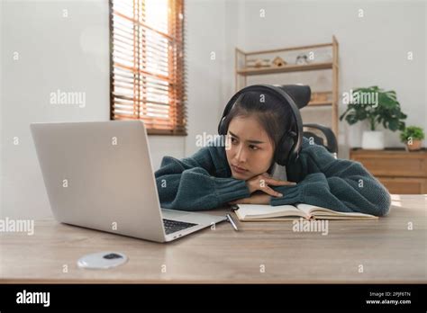 Bored Young Asian Girl Student Studying Looking Upset At Laptop Screen