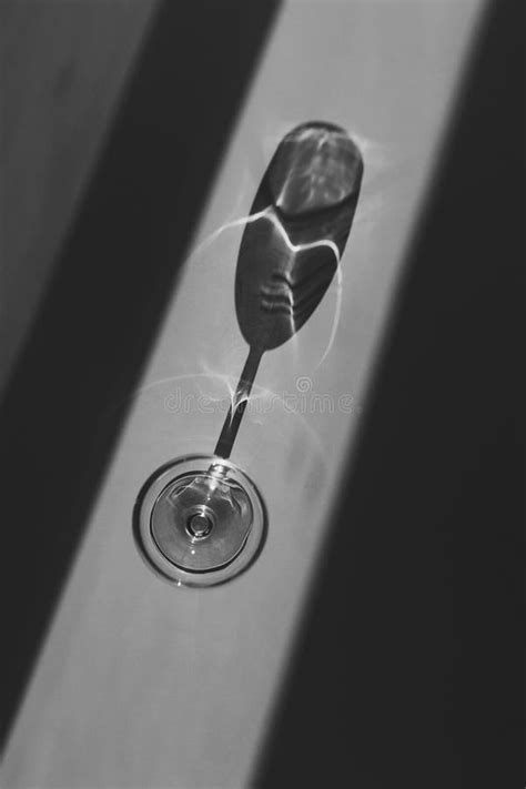 Flare And Shadow From Empty Wine Glass Empty Wine Glass On Table Black And White Image Stock