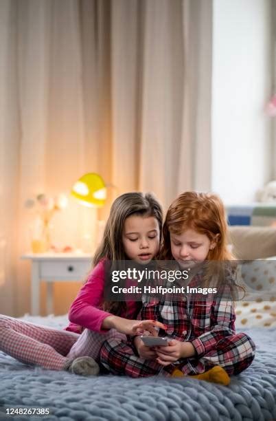 Friends Sleeping In Bed Together Photos And Premium High Res Pictures