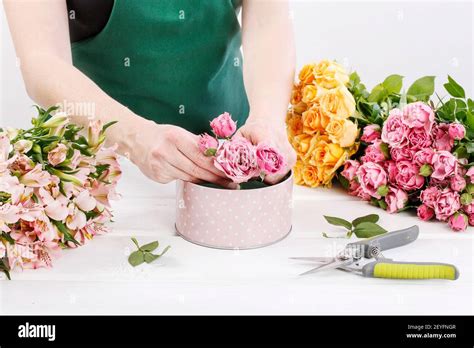 Florist At Work Woman Shows How To Make Floral Arrangement With Roses