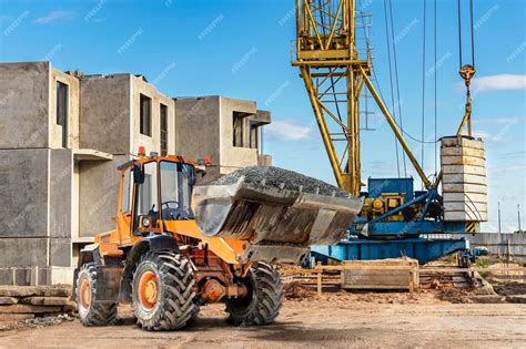Premium Photo Bulldozer Or Loader At The Construction Site Transports Gravel Or Crushed Stone