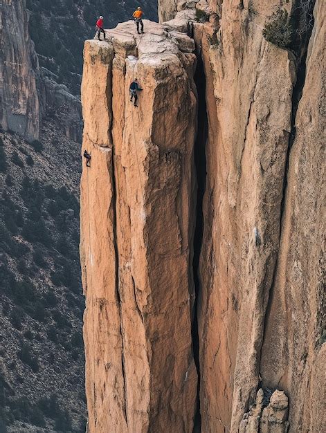 Expert Rock Climbers Conquer Sheer Vertical Cliff Premium Ai