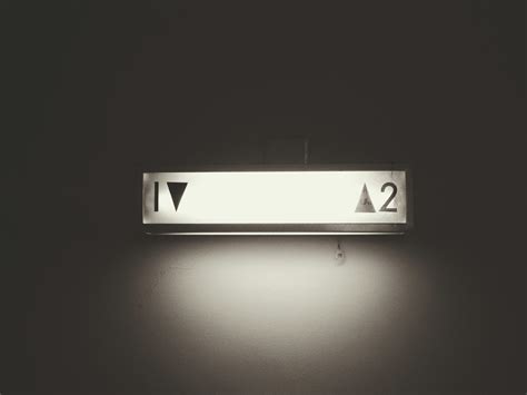 Gray Framed 1 And 2 Elevator Signage Photo Free Black Image On Unsplash