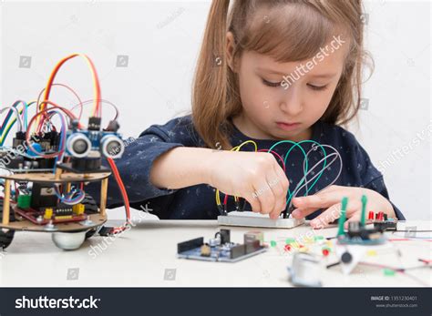 Cute Girl Constructs Metal Robot Program Stock Photo Shutterstock