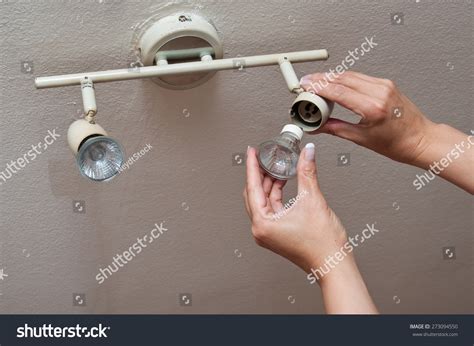 Woman Changing Light Bulb Stock Photo 273094550 Shutterstock