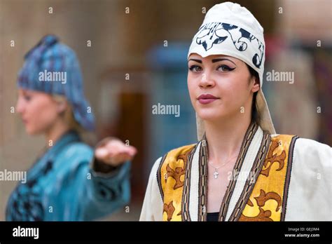 Uzbek model presenting local hats and clothes in Bukhara, Uzbekistan ...