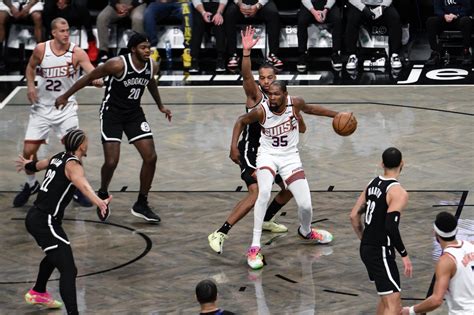 Kevin Durant, Devin Booker lead Suns past skidding Nets | Reuters