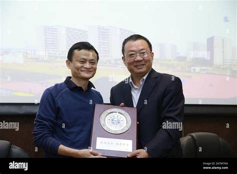 File Jack Ma Left Takes Photos With The Headmaster Of Hangzhou