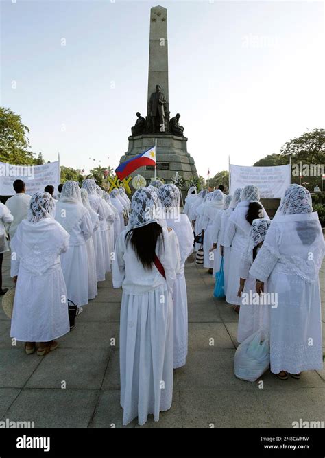 Followers Of Philippine National Hero Jose Rizal Stand In Front Of The