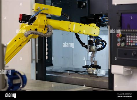 collaborative robot loading workpieces into cnc machining center