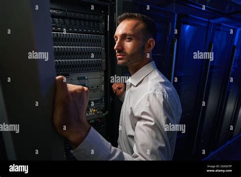 Bearded Busy Man Technician Finding And Troubleshooting Computer Server