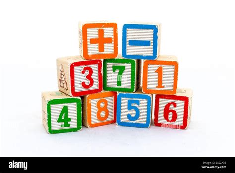 Wooden Blocks With Numbers And Plus And Minus Sign Isolated On White