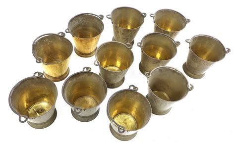 Lot 106 A Set Of Eleven Brass Buckets