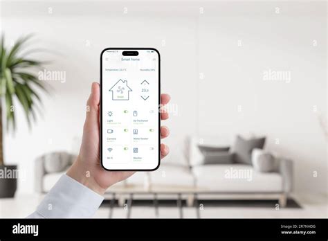 Smart Home App Concept On Mobile Home In Woman Hand Living Room