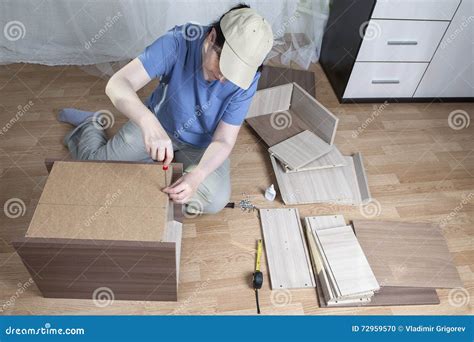 Assembling Bedside Tables According To The Drawing Royalty Free Stock Image