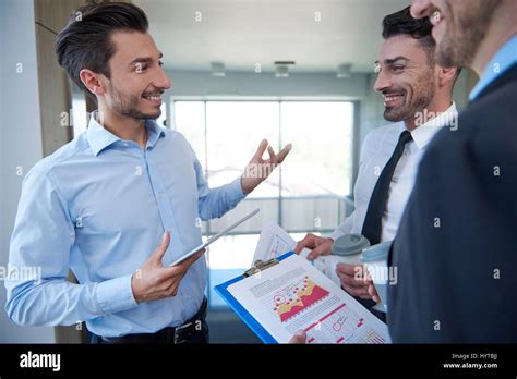 Three Men Analyzing Some Data Stock Photo Alamy