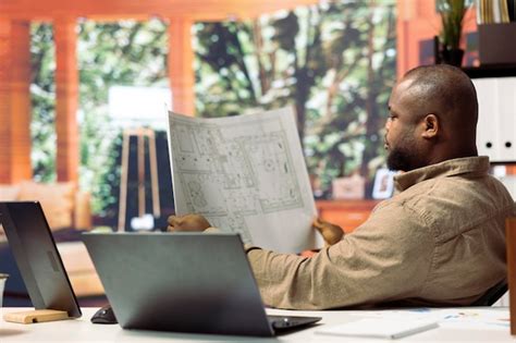 Free Photo Professional Entrepreneur Evaluating Building Layout On