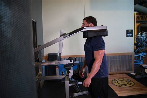 Calf Machine Shoulder Shrug Exercise Guide And Video