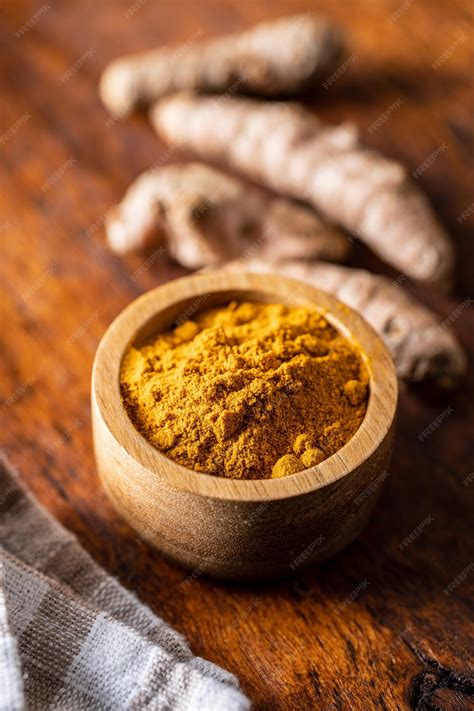 Premium Photo Indian Turmeric Powder And Root Turmeric Spice Ground Turmeric