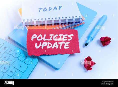 Hand Writing Sign Policies Update Word Written On Act Of Adding New