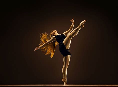 Download Graceful Performance By A Professional Ballet Dancer Wallpaper