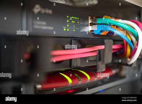 Router And Switch With Colorful Lan Cables In A Network Cabinet Of A