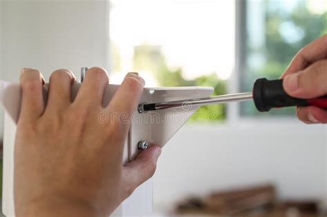 Asian Man Assembling White Table Furniture At Home Stock Image Image