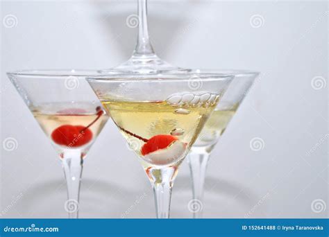 Three Martini Glasses With Cherries And Liquid Nitrogen Creating