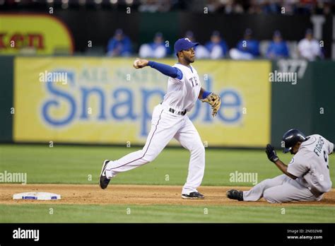 Texas Rangers Elvis Andrus Left And Seattle Mariners Chone Figgins Bottom During A