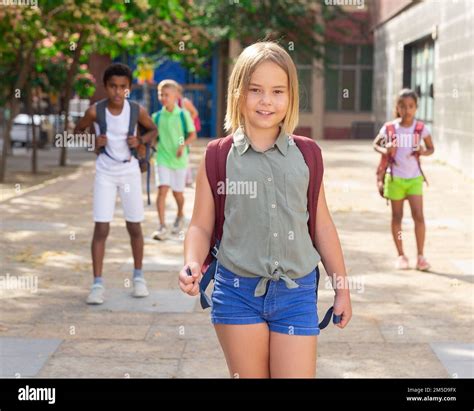 Cheerful Preteen Girl With Backpack Going To School On Summer Day Stock