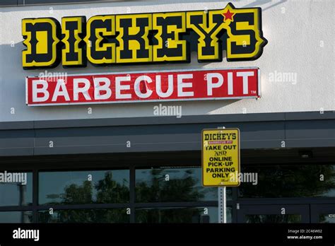 A Logo Sign Outside Of A Dickeys Barbecue Pit Restaurant Location In Hanover Pennsylvania On