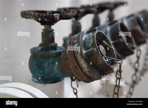 Rusty Brass Fire Hydrant Valves With Securing Plug To Connect To Water