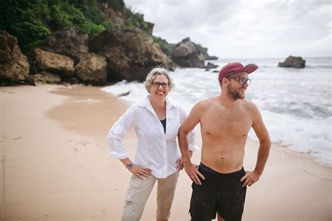 Happy Woman And Mother With Adult Son On Tropical Beach By Stocksy