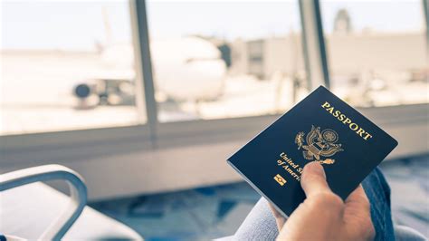 Download Passport Holding At Airport Wallpaper