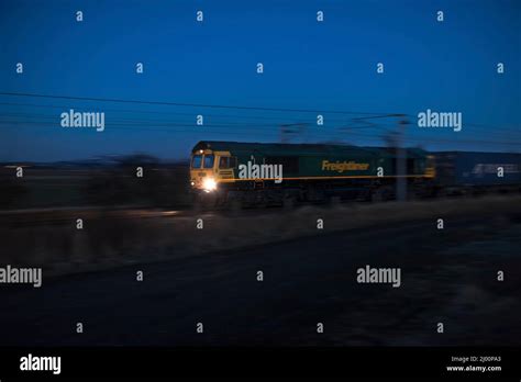 Freightliner Emd Class 66 Diesel Locomotive 66591 Hauling A Container