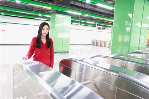 Woman Insert Ticket To Ticket Entrance Train Station Stock Image