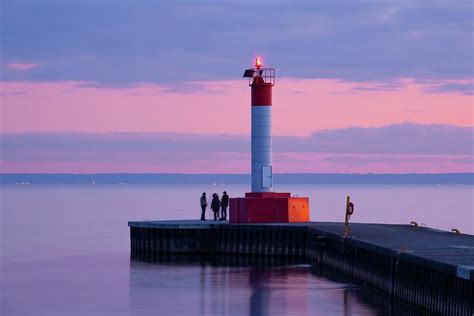 A Lighthouse During A Colourful Sunset Photograph By James Hackland