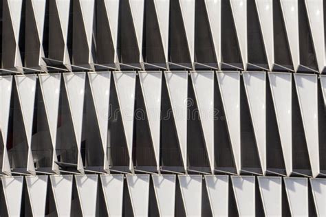 Facade With Alternating Dark And Light Triangular Shapes Creating A