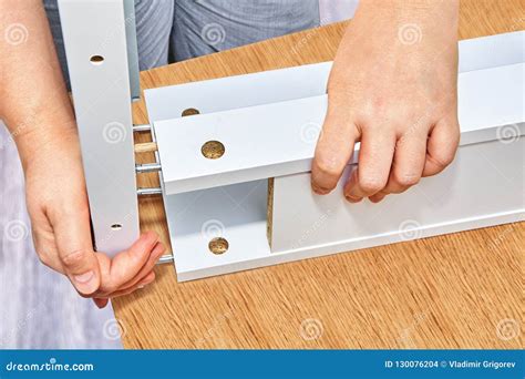 Furniture Assembler Connects Parts Of Table Flat Pack Furniture Stock