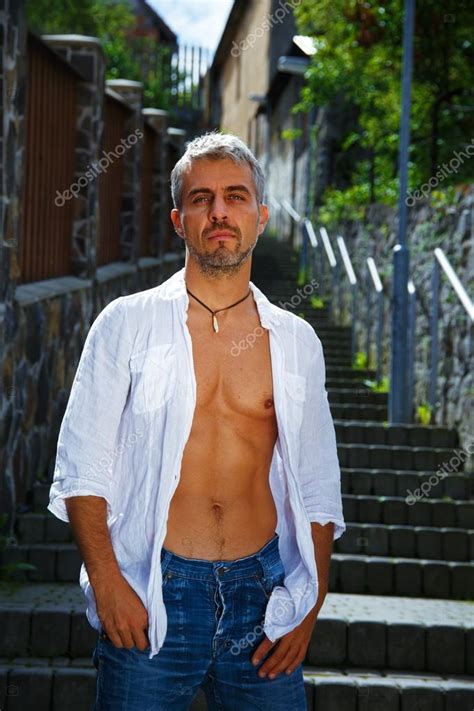 Sexy Fashion Portrait Hot Male Model In Stylish Jeans And Shirt With