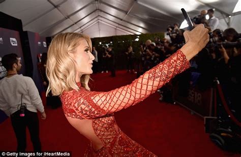 Braless Paris Hilton Flashes Her Underwear At Iheartradio Awards