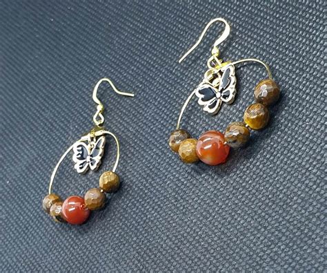 Tiigrisilmkarneool Kuldsed Kõrvarõngad Liblikaga Minervashopeu