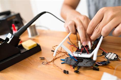 Premium Photo Man Assemble The Flying Drone