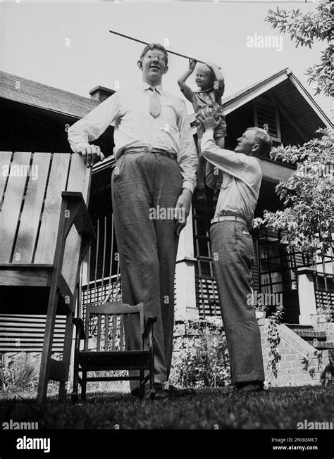 Harold Wadlow Right Lifts His Four Year Old Son Harold Jr Who