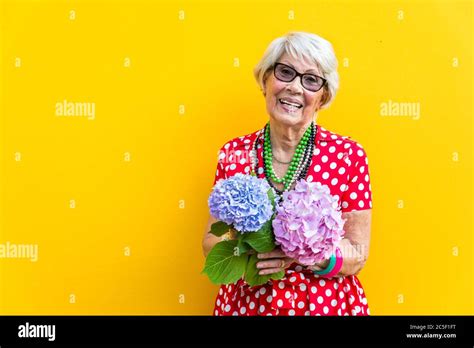 Happy And Playful Senior Woman Having Fun Portrait Of A Beautiful